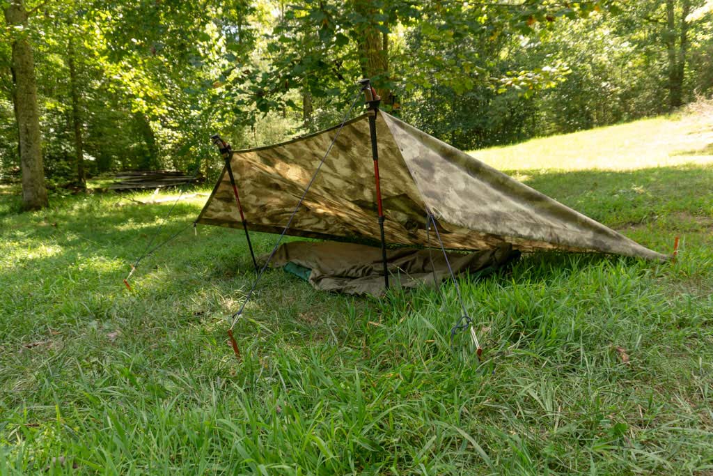 Stay warm and dry with these improvised tarp shelters