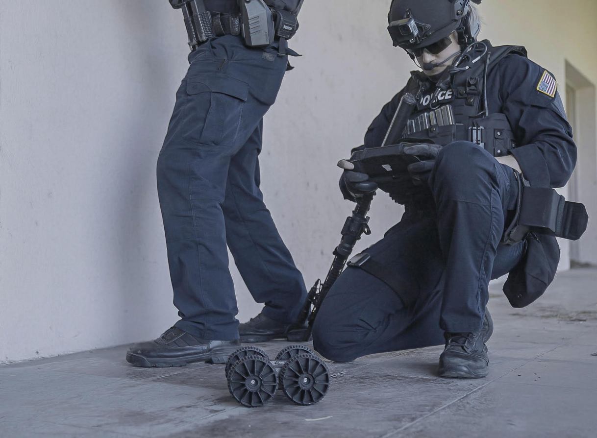 Watch a small throwable robot get run over by a car | Popular Science