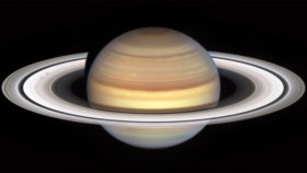 Saturn's rings glow in latest JWST image | Popular Science