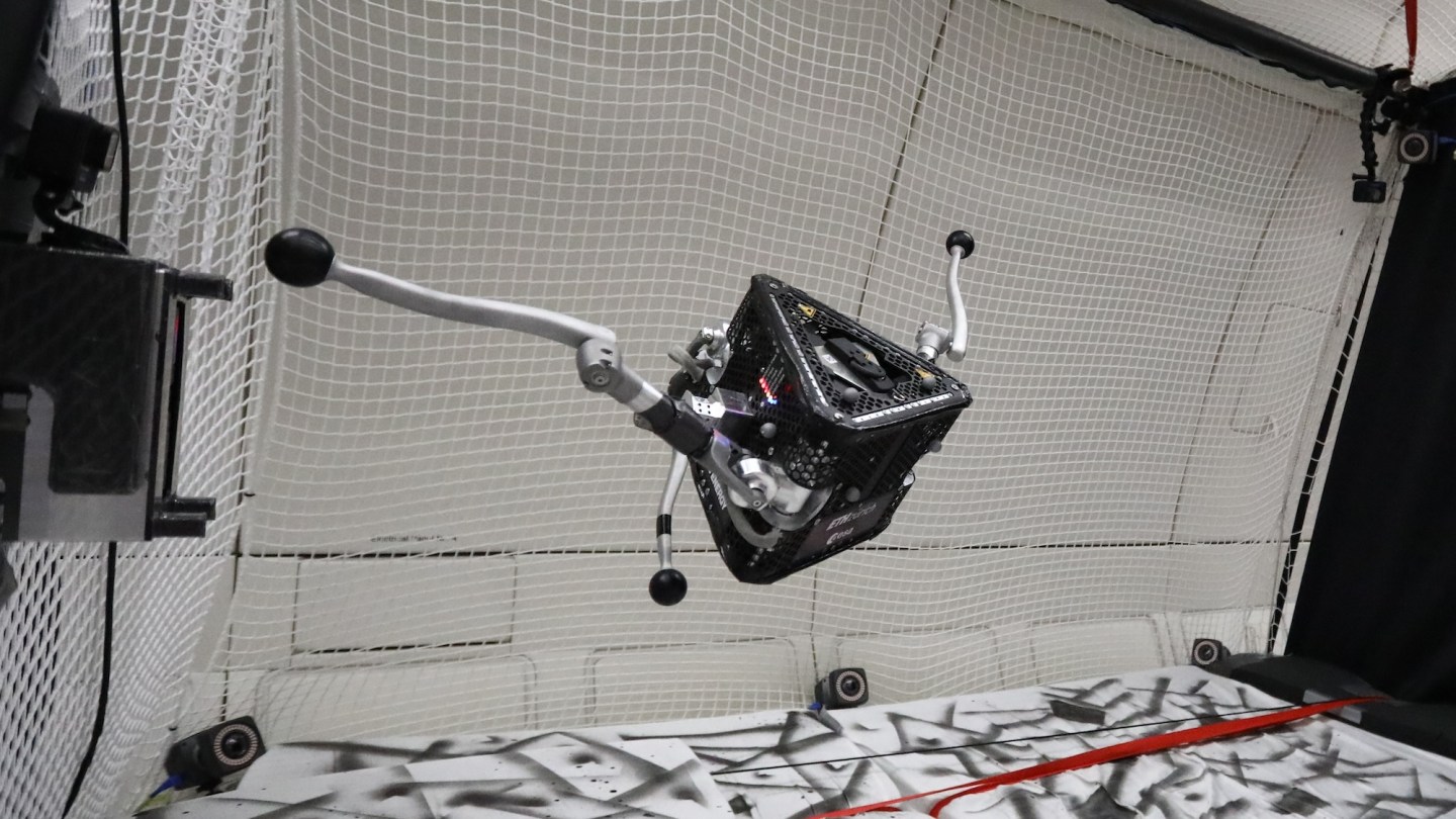 Watch a tripod robot test its asteroid leaping skills | Popular Science