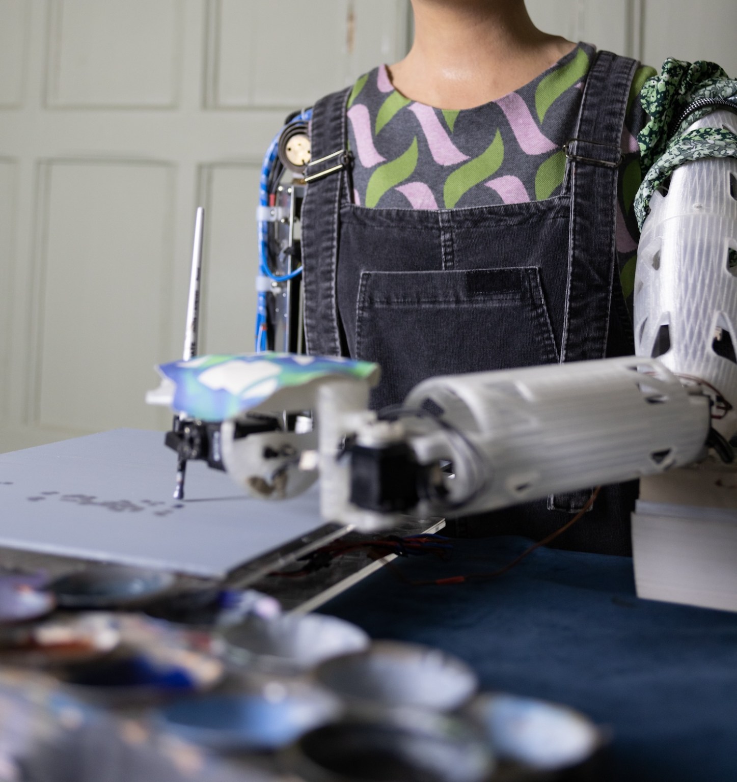 A humanoid robot's painting called 'AI God' may sell for over $120,000 ...