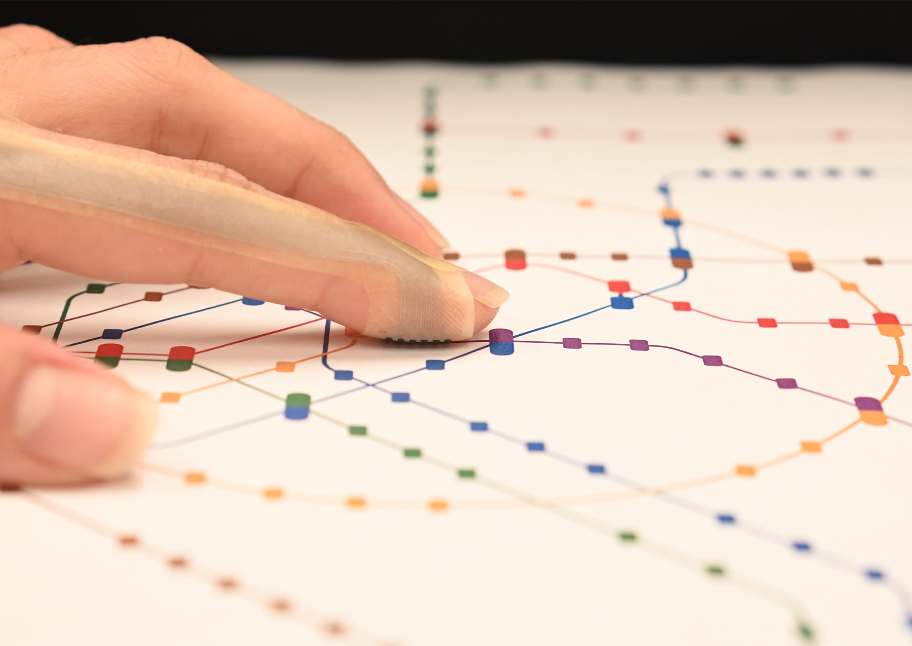 New wearable device lets you touch fabric online, read braille, and ...